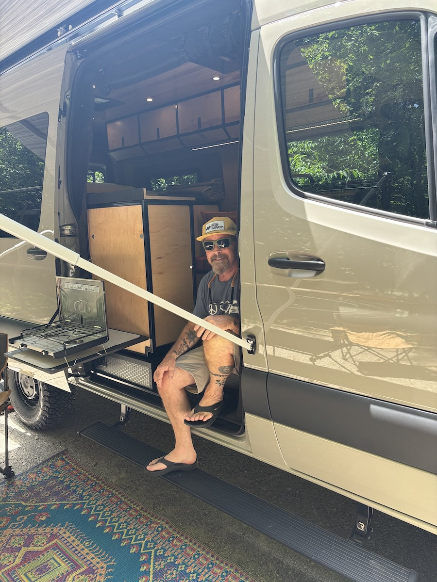 Mike in Van wLaptop – Vanlife Outfitters